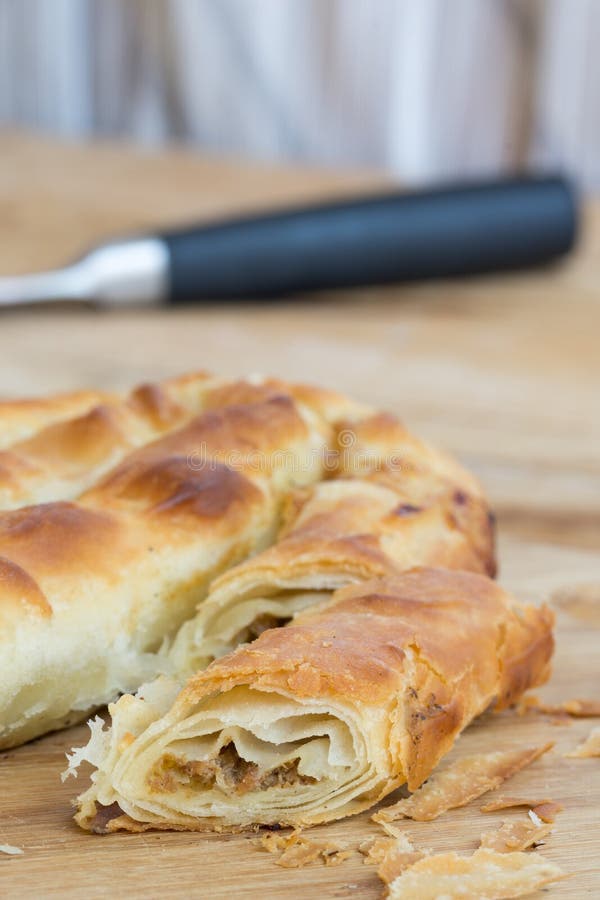 Sliced Burek with Meat on the Wooden Board. Rustic Food. Stock Photo ...
