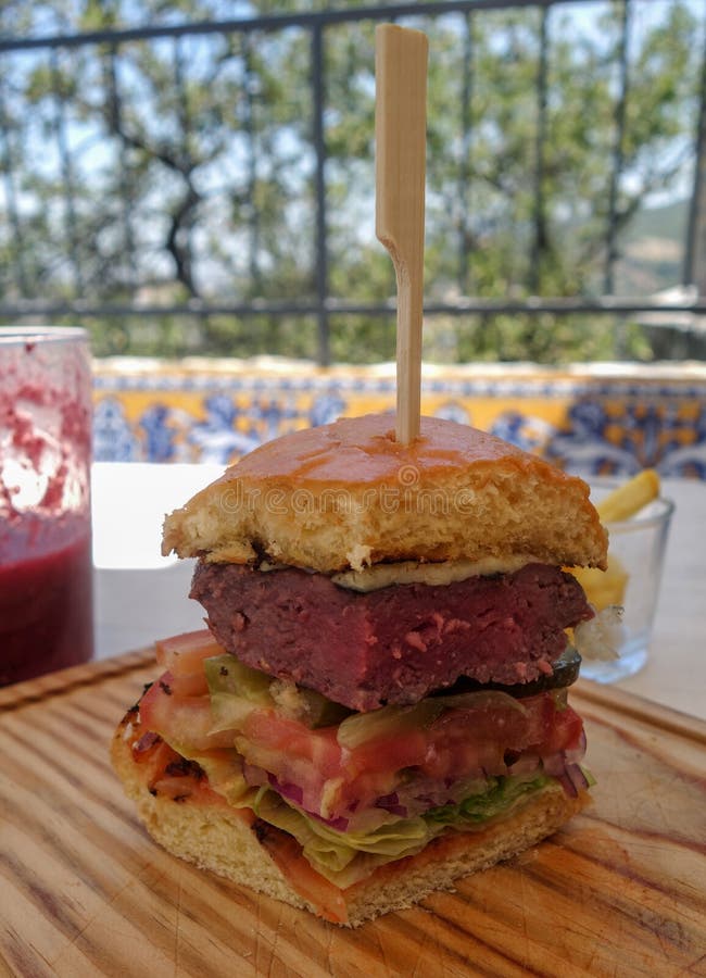 Sliced Burger Stack on Chopping Board Stock Image - Image of tomato ...