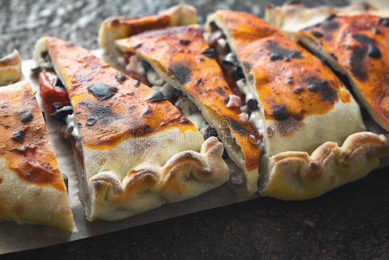 Sliced Calzone on the Stone Background Horizontal Stock Image - Image ...