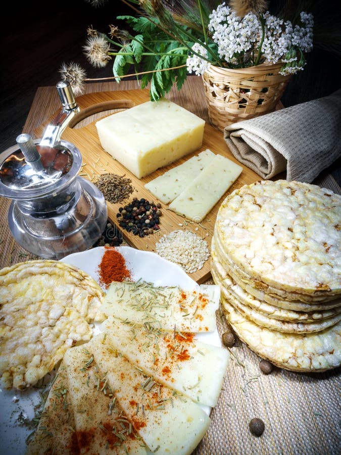 Sliced Cheese in a Bowl with Spices and Corn Crackers Stock Image ...