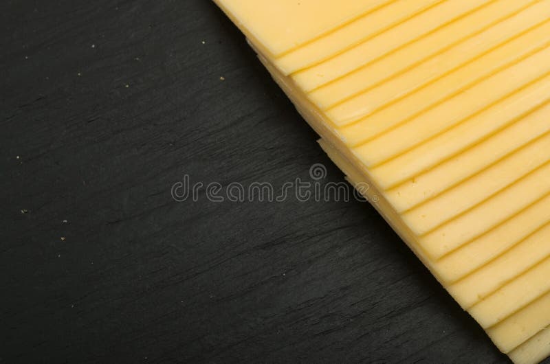 Sliced Cheese Over Stone Background Stock Image - Image of product ...