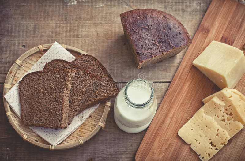 Sliced Cheese, Rye Bread and Milk Stock Image - Image of village, milk ...