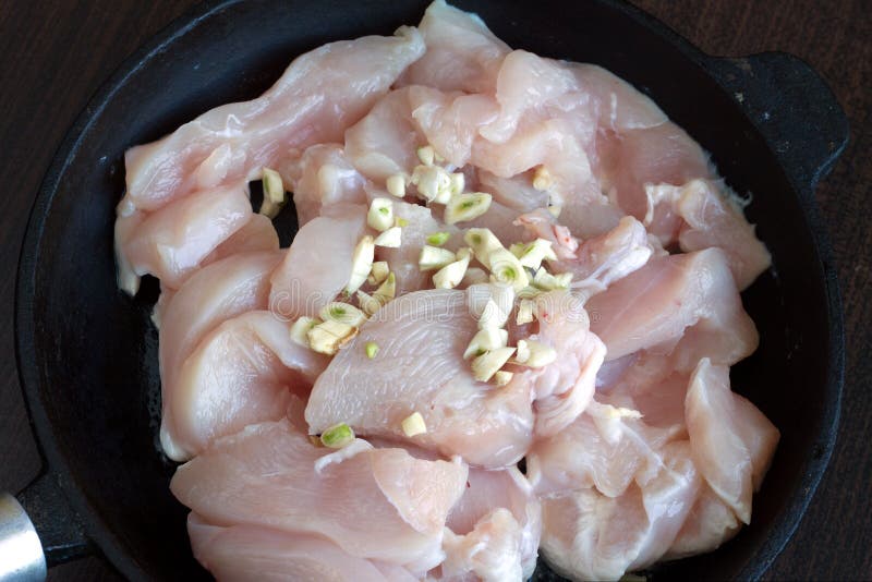 Sliced Chicken Meat with Spice and Garlic while Cooking Stock Photo ...