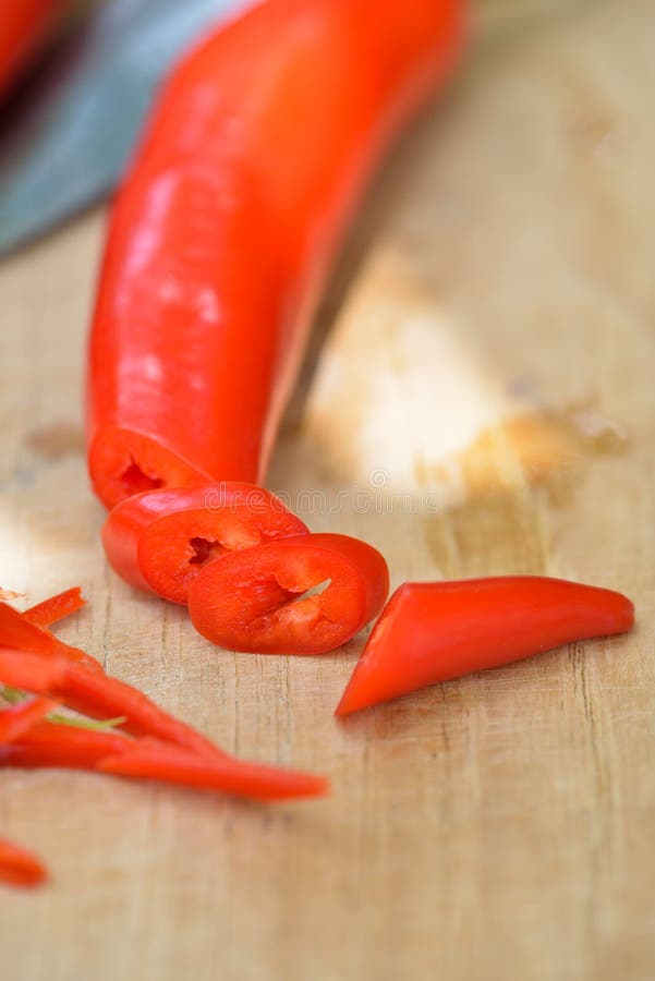 Sliced Chili Pepper on Wood Chopping Board Stock Image - Image of ...