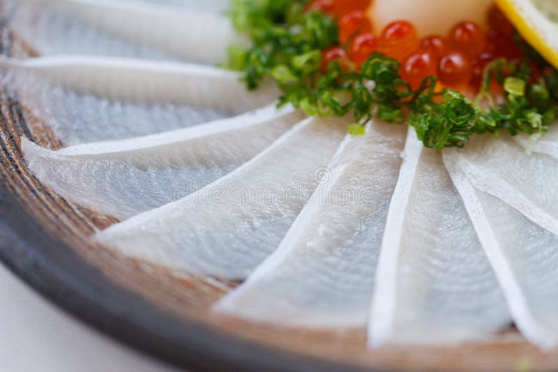 Sliced Cod Fish Sashimi Served with Ikura Salmon Roe, Scallion and ...