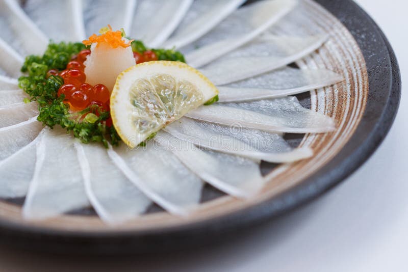 Sliced Cod Fish Sashimi Served with Ikura Salmon Roe, Scallion and ...