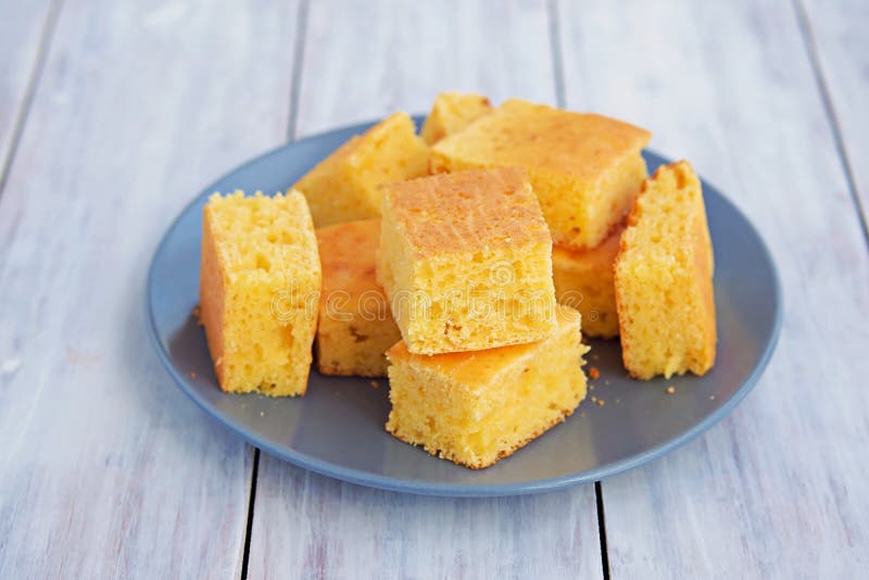 Sliced Cornbread on a Gray Plate on a Light Wooden Background. Corn ...