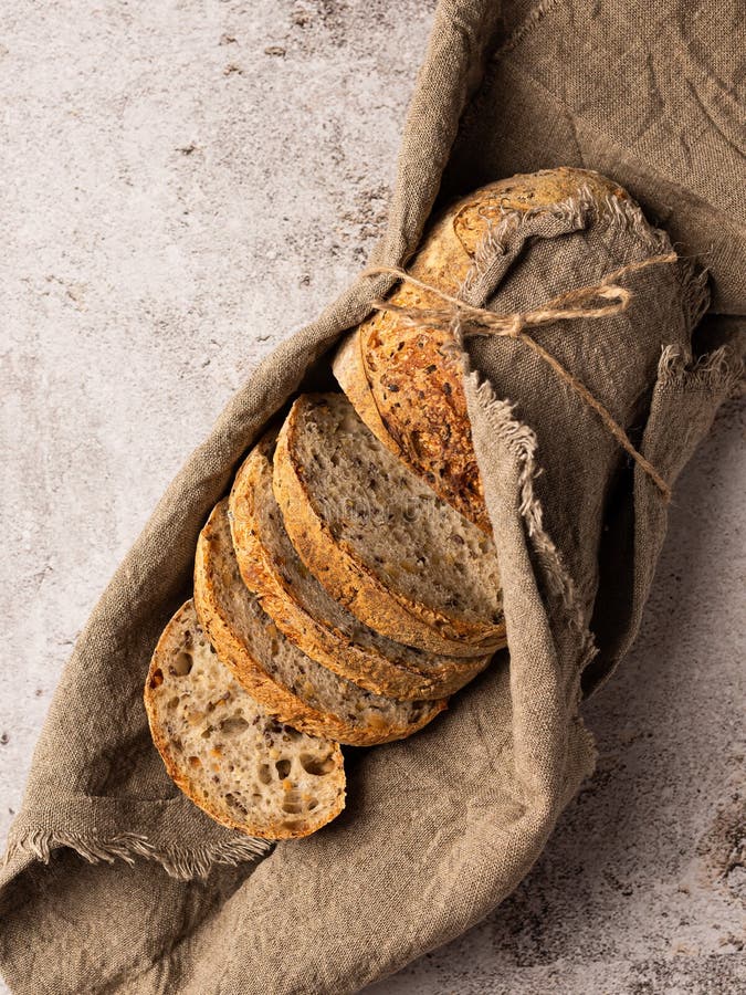 Sliced Crusty Bread is Wrapped in Burlap. Tied with String Stock Image ...