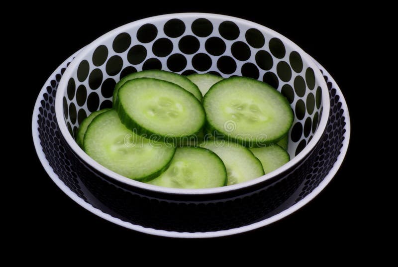 Sliced cucumber in bowl. stock image. Image of black, food - 4462893