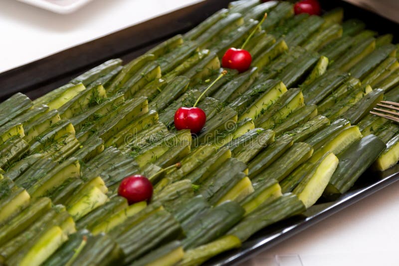 Sliced Cucumbers on the Tray are Decorated with Cherries Stock Photo ...