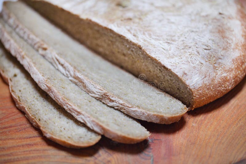 A Rustic Artisan Style French PavÃ© Bread Loaf on a Bread Board Stock ...