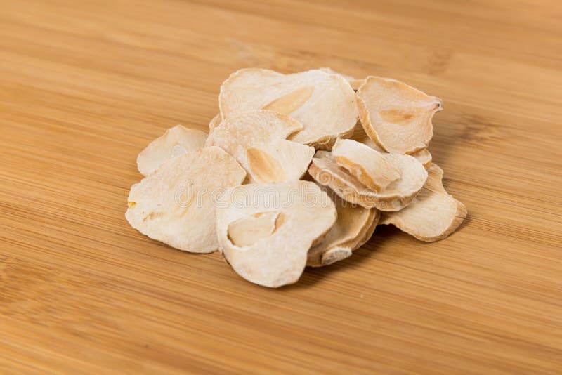 Sliced Dried Shallots in a Pile on a Wood Cutting Board Stock Image ...