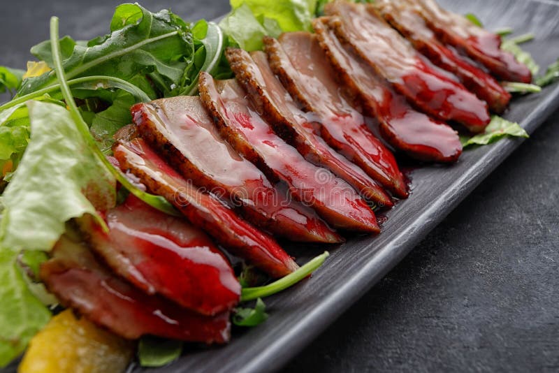 Sliced Duck Breast in Caramel with Oranges Stock Photo - Image of ...