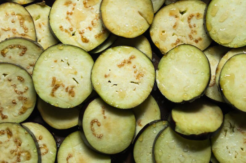 Sliced Eggplants. Eggplants are Rings. Background of Aubergines Stock ...