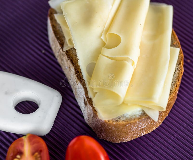 Sliced emmental on bread stock image. Image of appetizer - 134502619