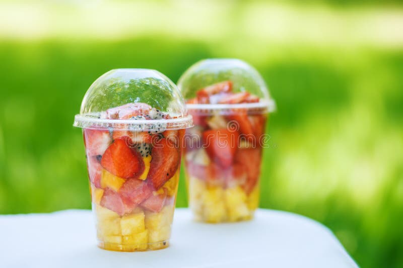 Sliced Fruits in cup stock photo. Image of juicy, background - 77090826