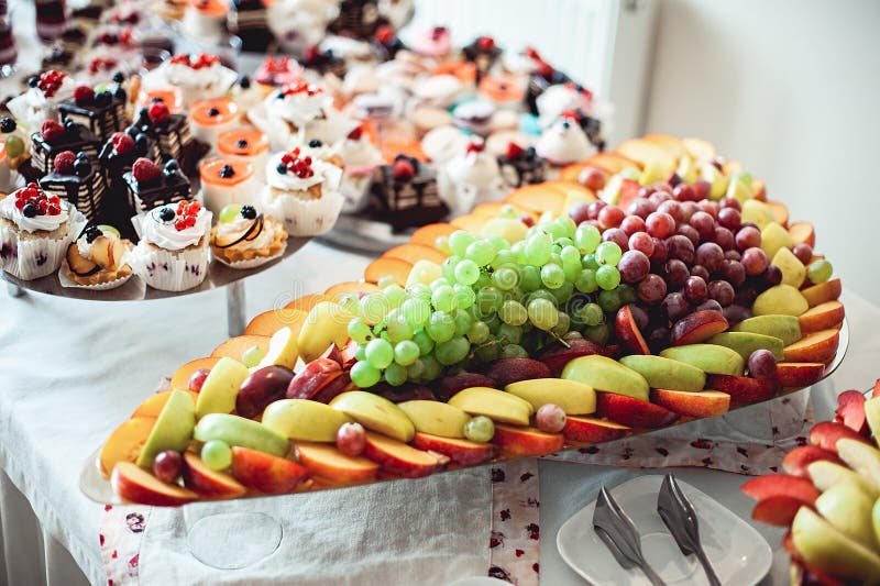 Sliced Fruits on a Stand on a White Table Stock Image - Image of ...