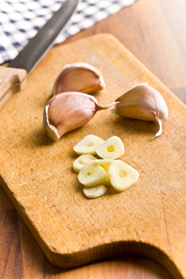 Sliced Garlic on Kitchen Table Stock Photo - Image of eating, gourmet ...
