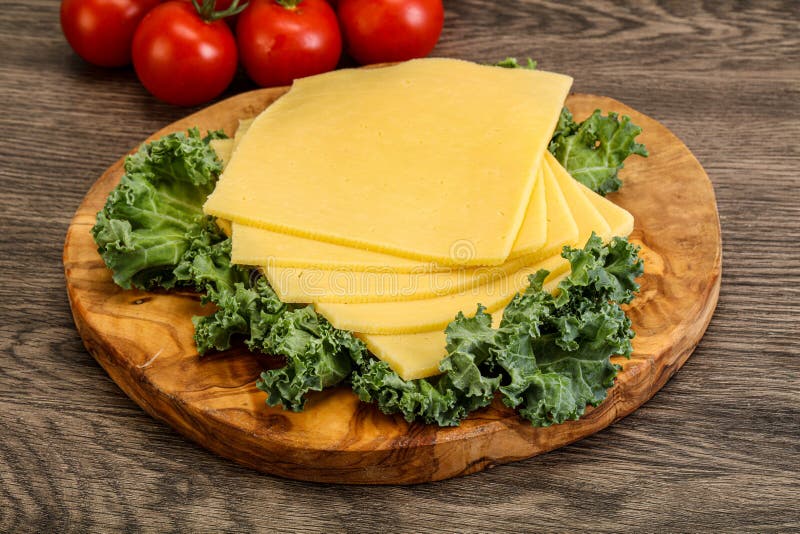 Sliced Gauda Cheese Over Board Stock Image - Image of food, isolated ...
