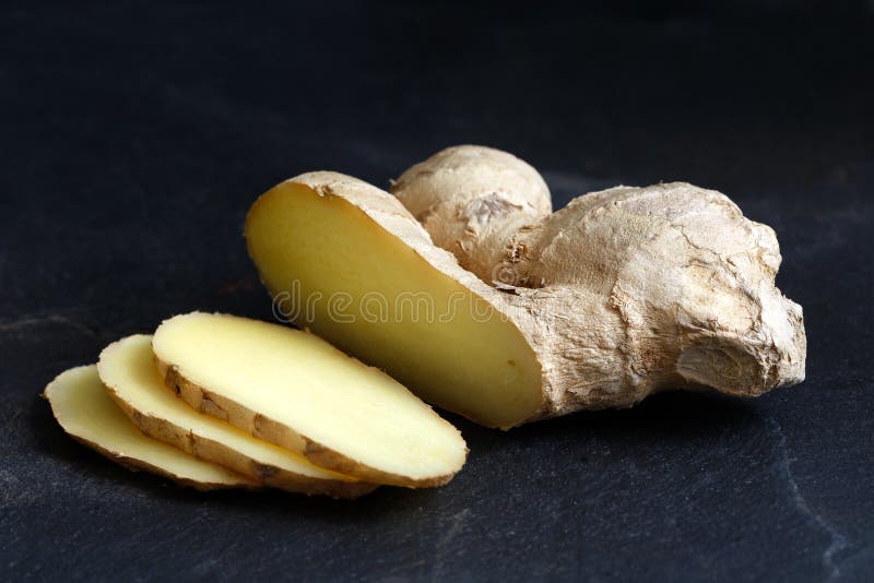 Sliced Ginger Root on Black Slate. Stock Photo - Image of sliced, spice ...