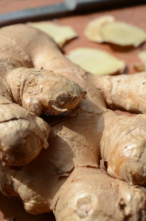 Sliced ginger root stock image. Image of shadows, knife - 90765609