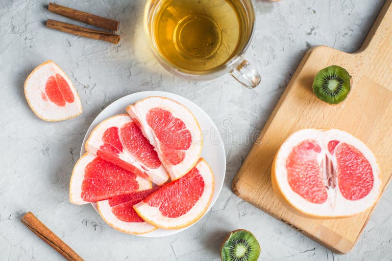 Sliced Grapefruit, Kiwi Fruit, Cinnamon, Tea Stock Image - Image of ...