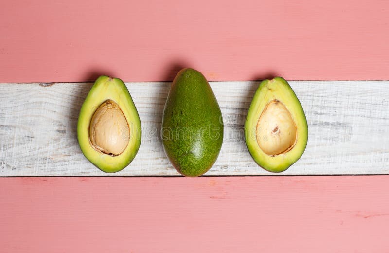 Sliced Green Avocado on a Red Surface Stock Image - Image of healthy ...