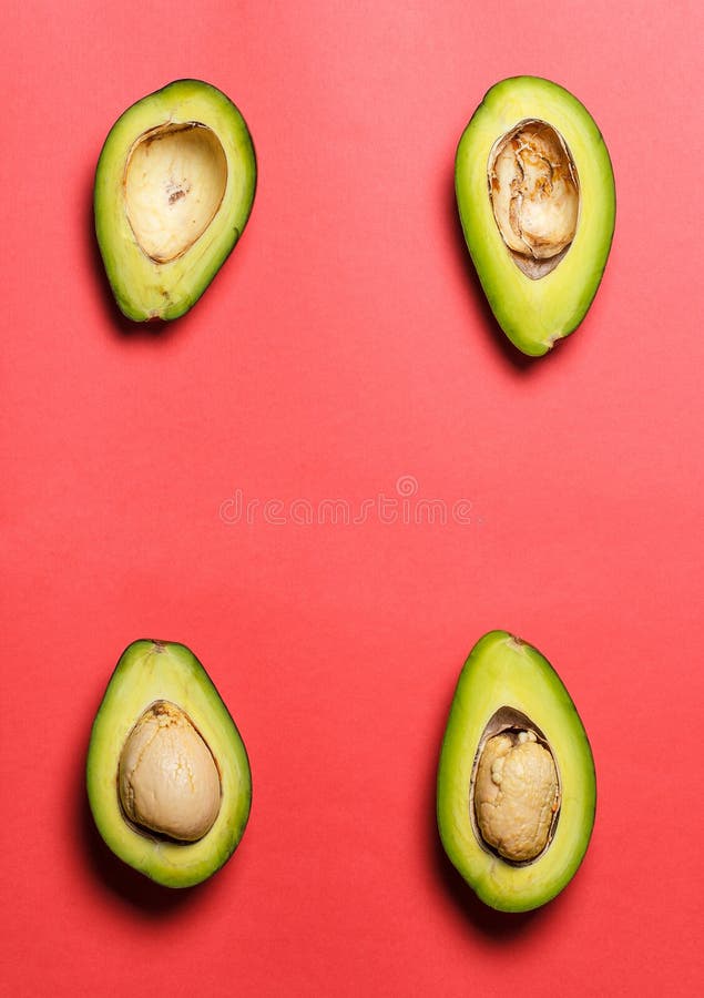 Sliced Green Avocado on a Red Surface Stock Photo - Image of eating ...