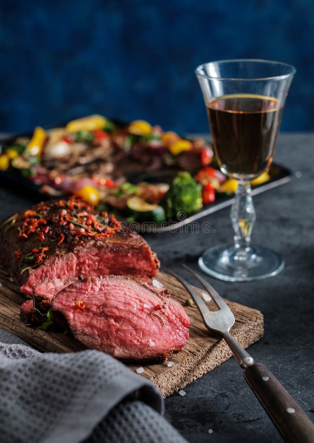Sliced Grilled Beef Rump Steak on Wooden Board with Vegetables Stock ...
