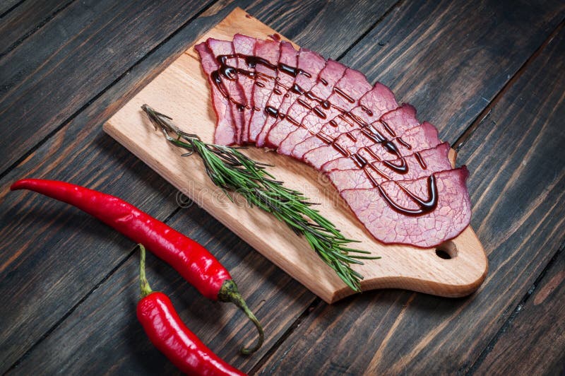 Sliced Ham, Chilli Pepper, Rosemary on a Wooden Board Stock Photo ...