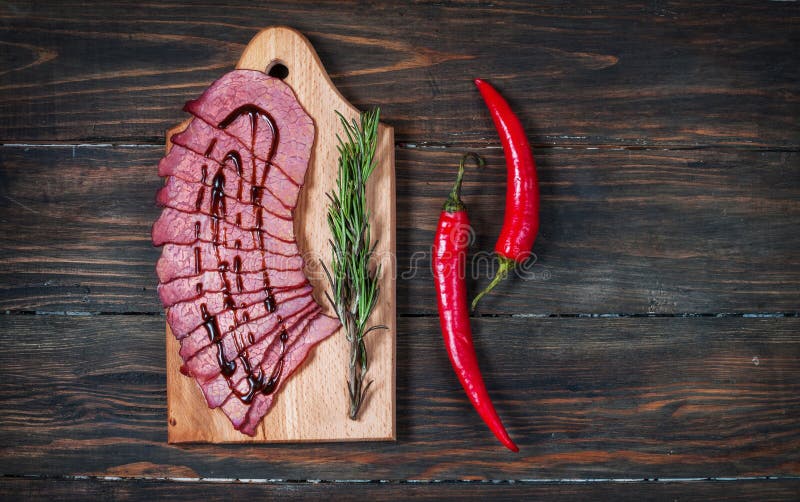 Sliced Ham, Chilli Pepper, Rosemary on a Wooden Board Stock Photo ...