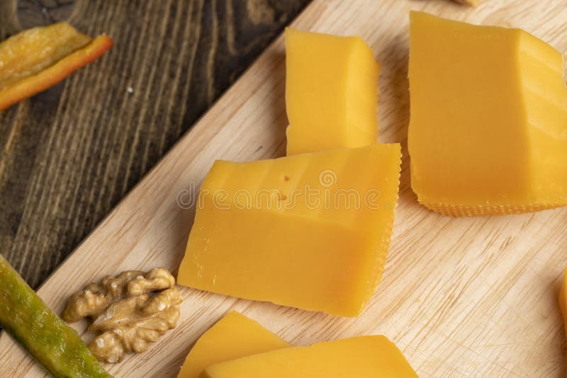Sliced Hard Cheese Made from Milk Stock Photo - Image of chop, board ...
