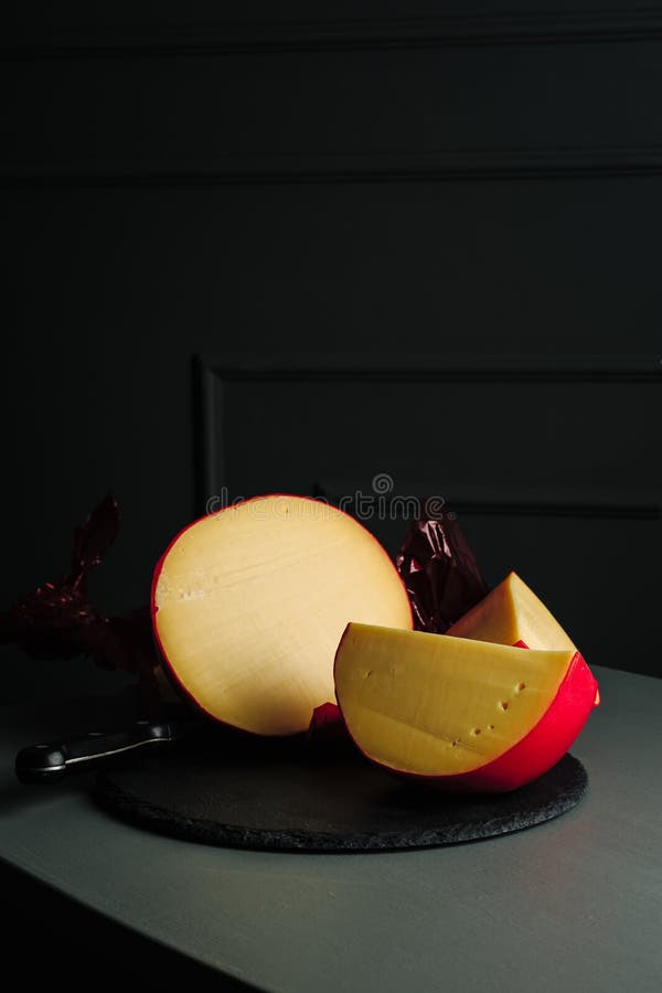 Sliced head of Edam cheese stock image. Image of protein - 278231135