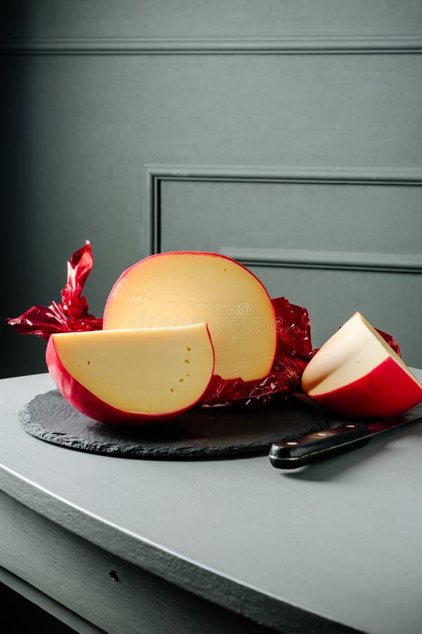 Sliced head of Edam cheese stock image. Image of protein - 278231135