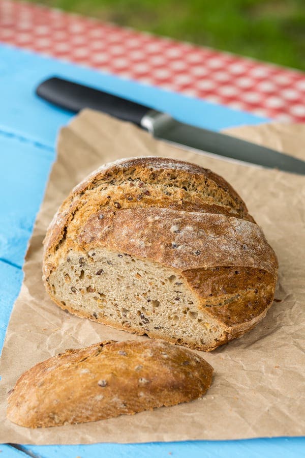 Sliced Healthy Round Black Bread on the Table with Knife Stock Image ...