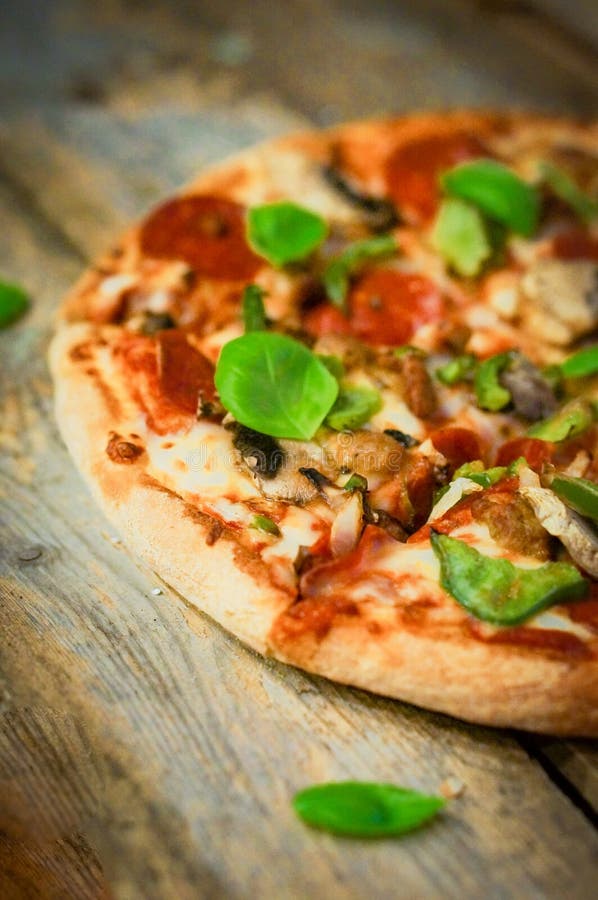 Sliced Home Made Pepperoni Pizza on Wooden Rustic Background Stock ...