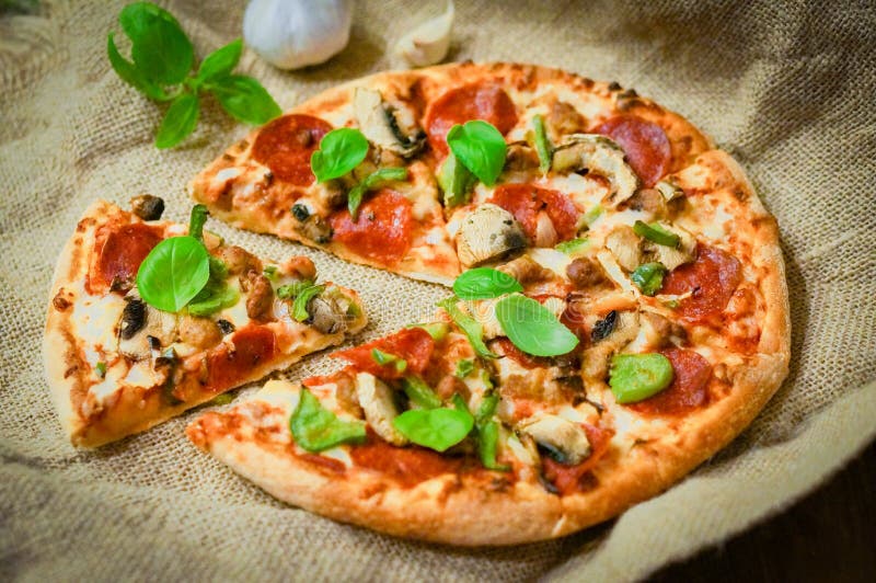 Sliced Home Made Pepperoni Pizza on Wooden Rustic Background Stock ...