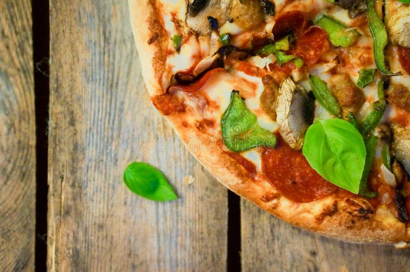 Sliced Home Made Pepperoni Pizza on Wooden Rustic Background Stock ...