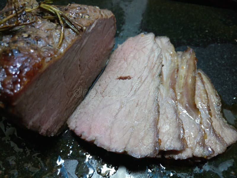 Sliced Juicy Cooked Meat on a Table Surface Stock Image - Image of ...