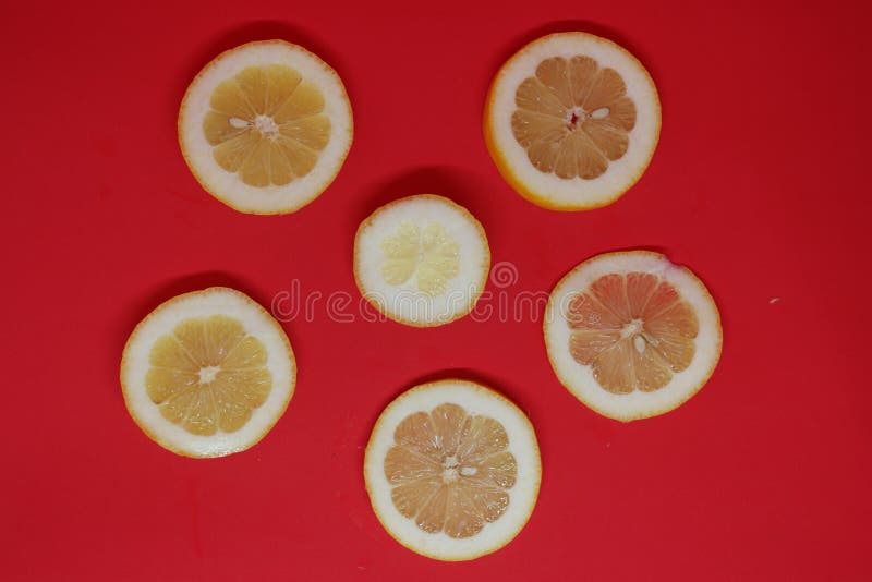 Sliced Lemons on Red Background Stock Photo - Image of food, slice ...