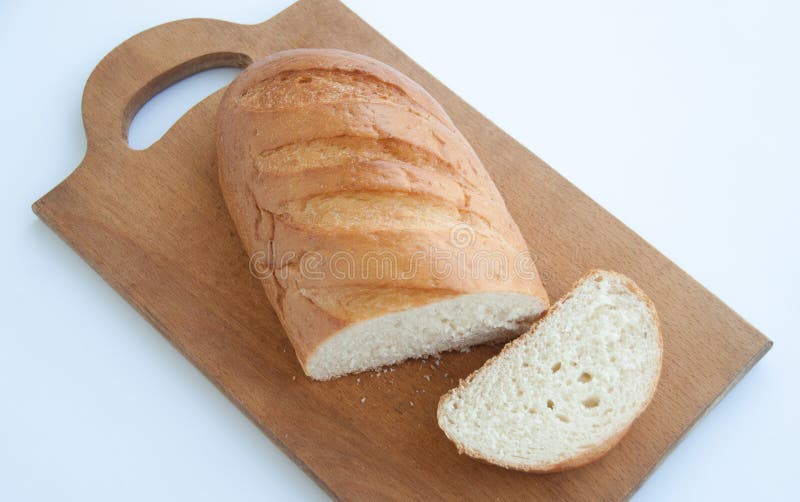 Sliced Loaf of Bread on a Cutting Board. Isolated on White Background ...