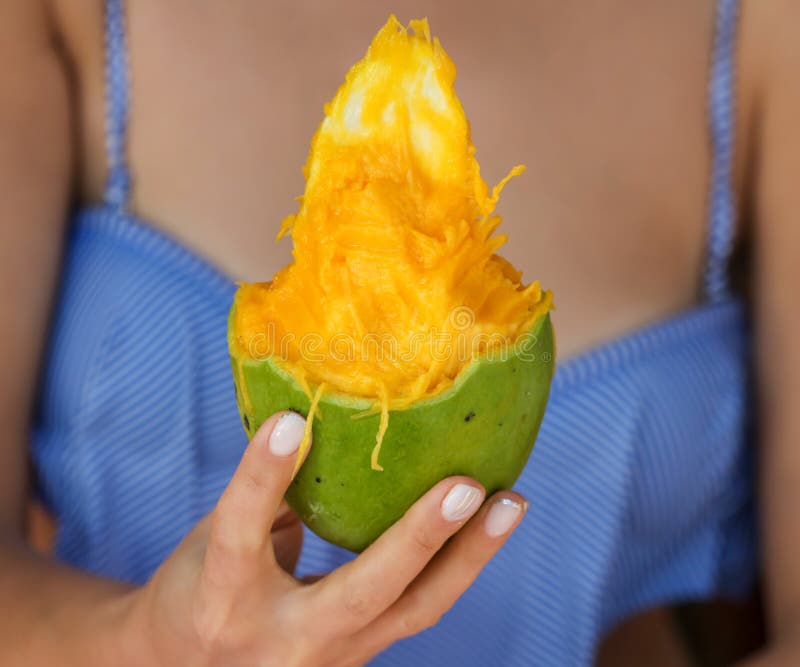 Sliced Mango Fruit in the Girlâ€™s Hand Stock Image - Image of single ...