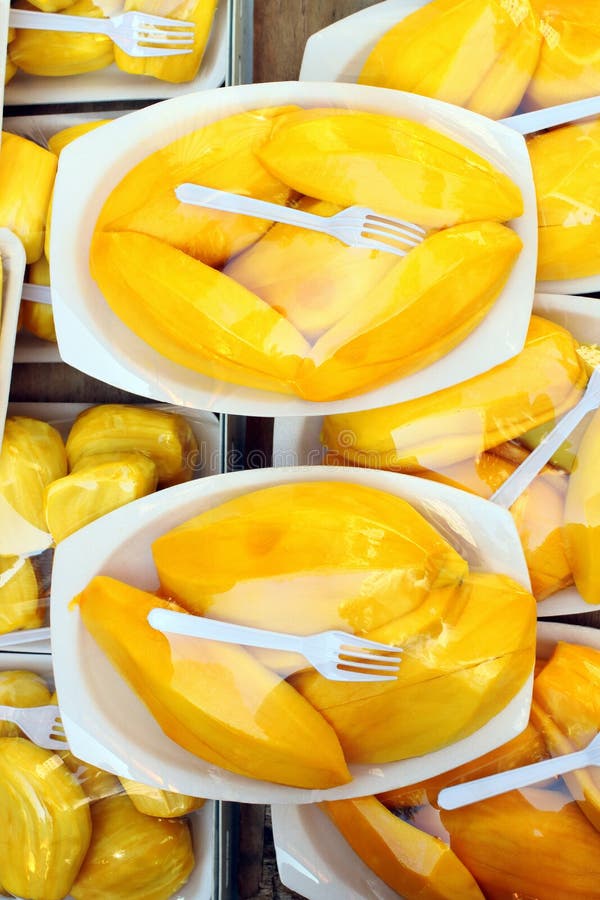 Pieces of Mango in a Plastic Plate with a Fork on the Counter Stock ...
