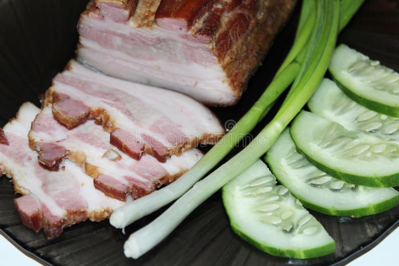 Sliced Meat on a Plate with Green Onions and Cucumbers Stock Image ...