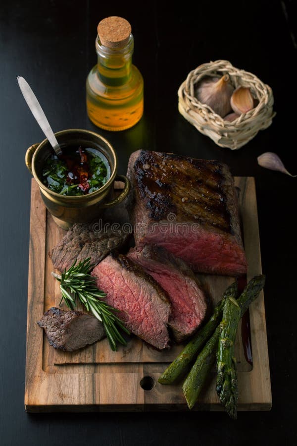 Sliced Medium Rare Grilled Beef Steak Stock Photo - Image of board ...