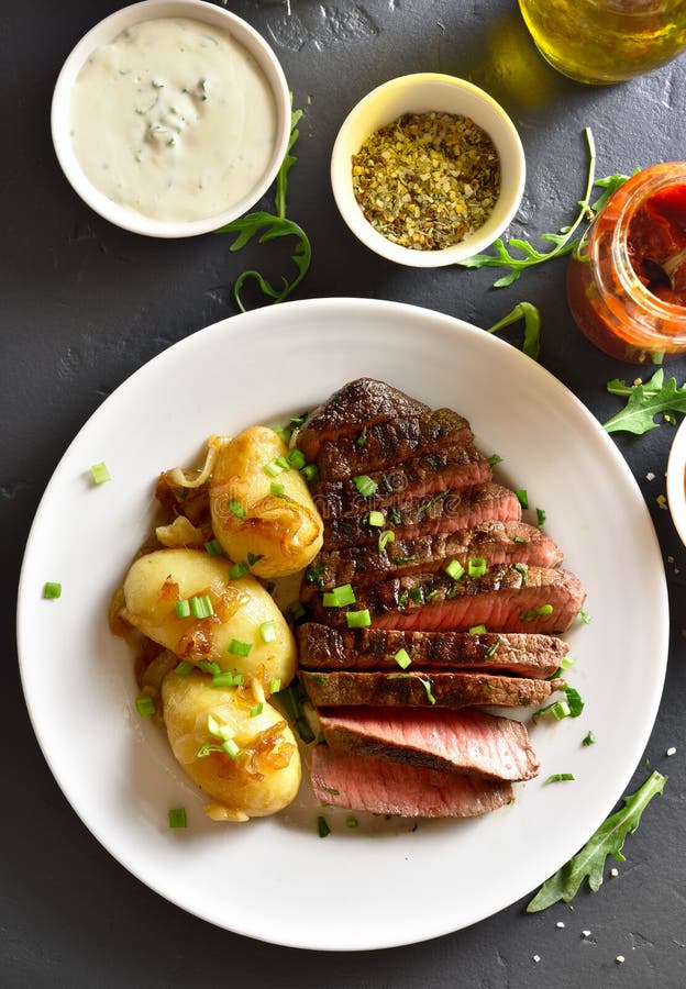Sliced Medium Rare Roast Beef with Potato Stock Photo - Image of ...
