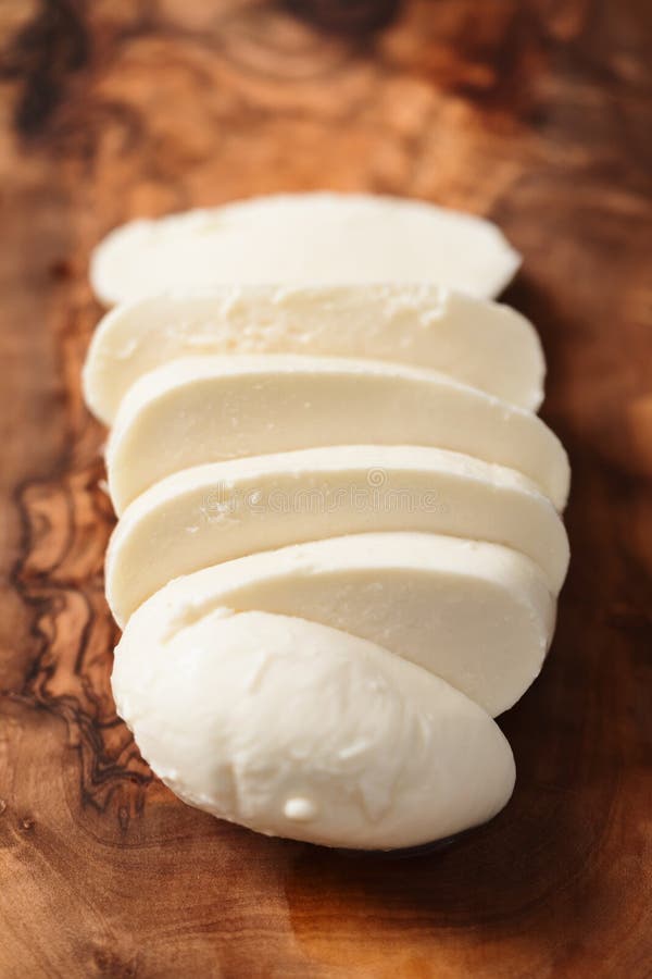 Sliced Mozzarella Cheese on Olive Wood Board Stock Image - Image of ...