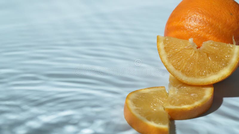 Sliced Oranges on Blue Textured Background with Shadow. Natural Light ...