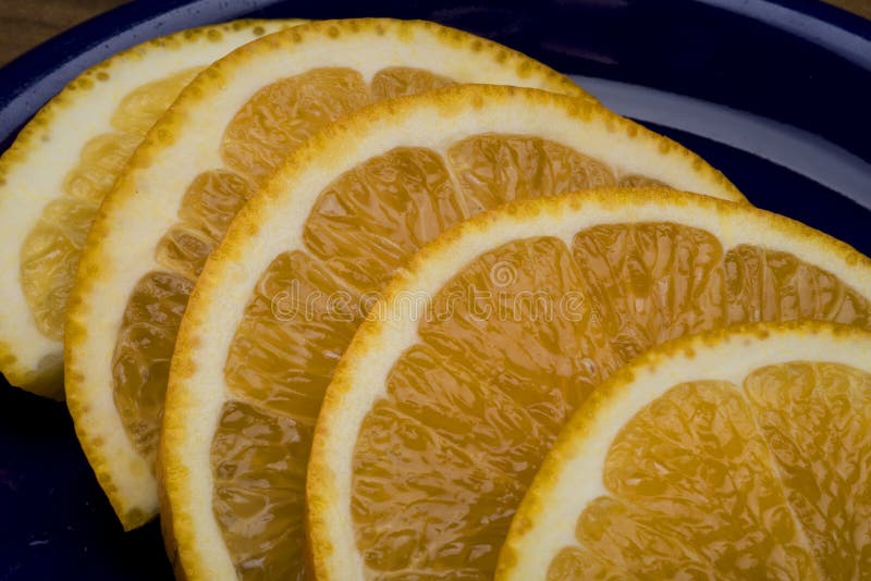 Sliced oranges on a plate stock photo. Image of slicedoranges - 86463806