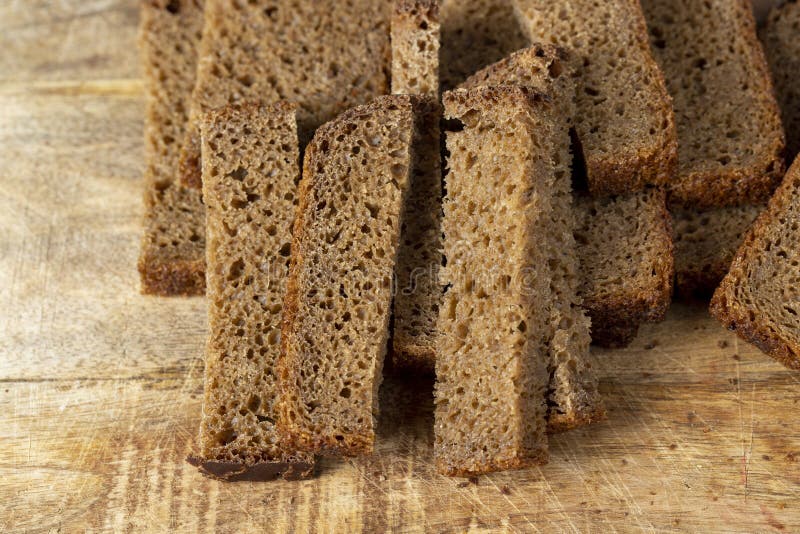 Sliced Piece of Black Rye Bread on a Board Stock Image - Image of ...